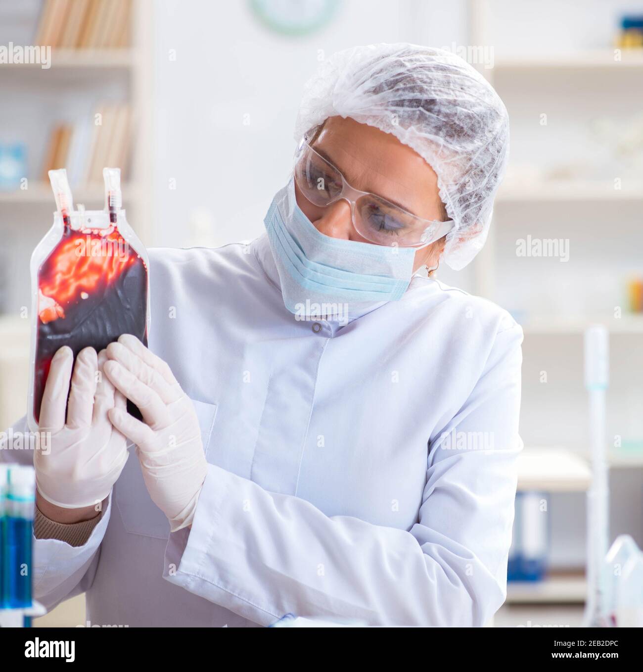 The woman doctor checking blood samples in lab Stock Photo - Alamy