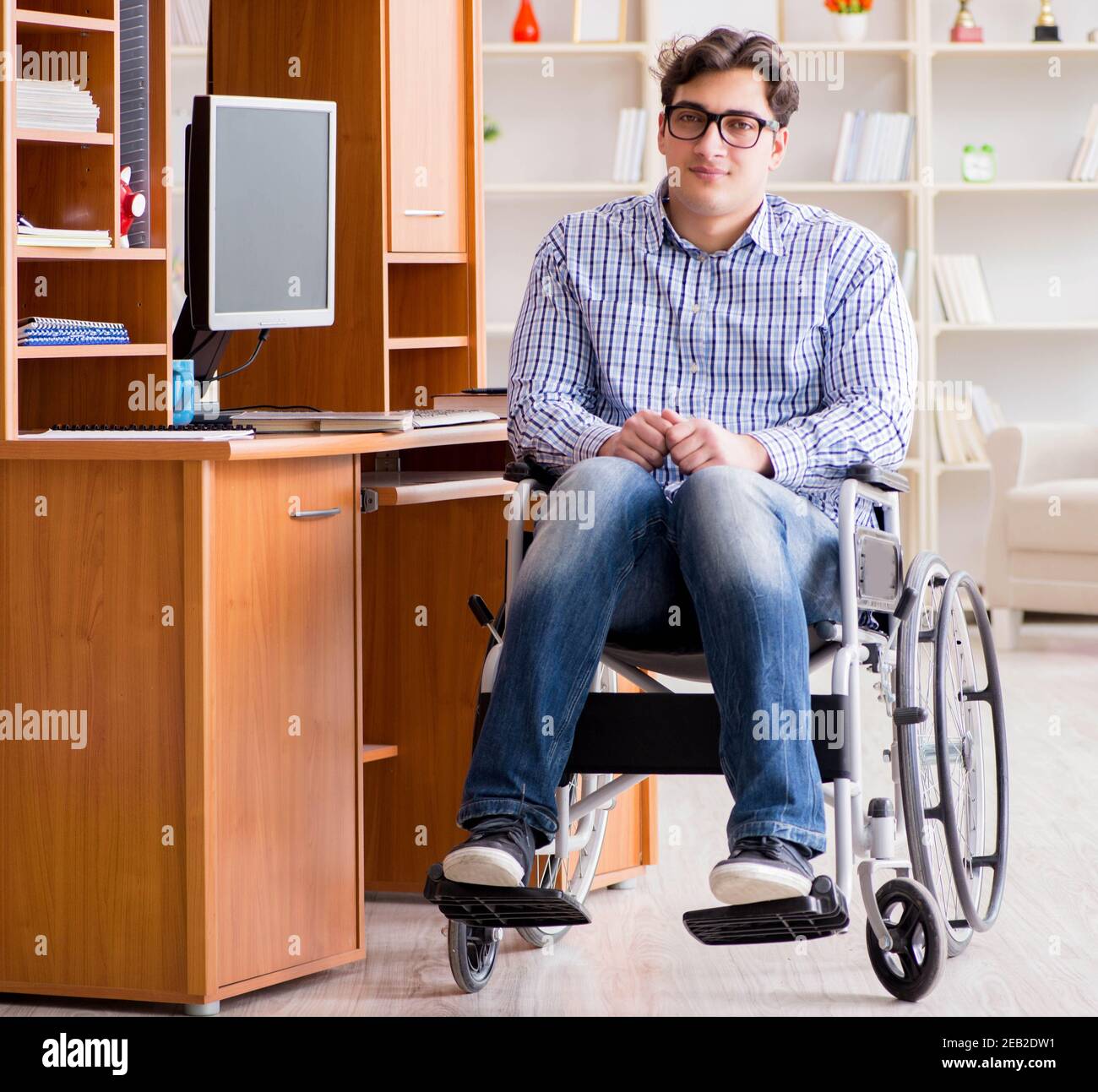 The disabled student studying at home on wheelchair Stock Photo - Alamy