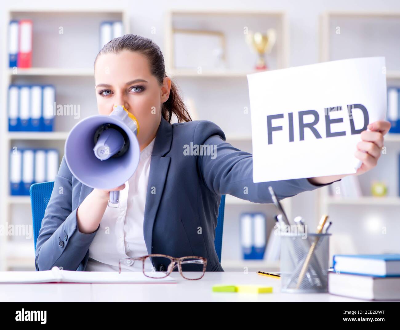 The angry businesswoman issuing termination notice Stock Photo - Alamy