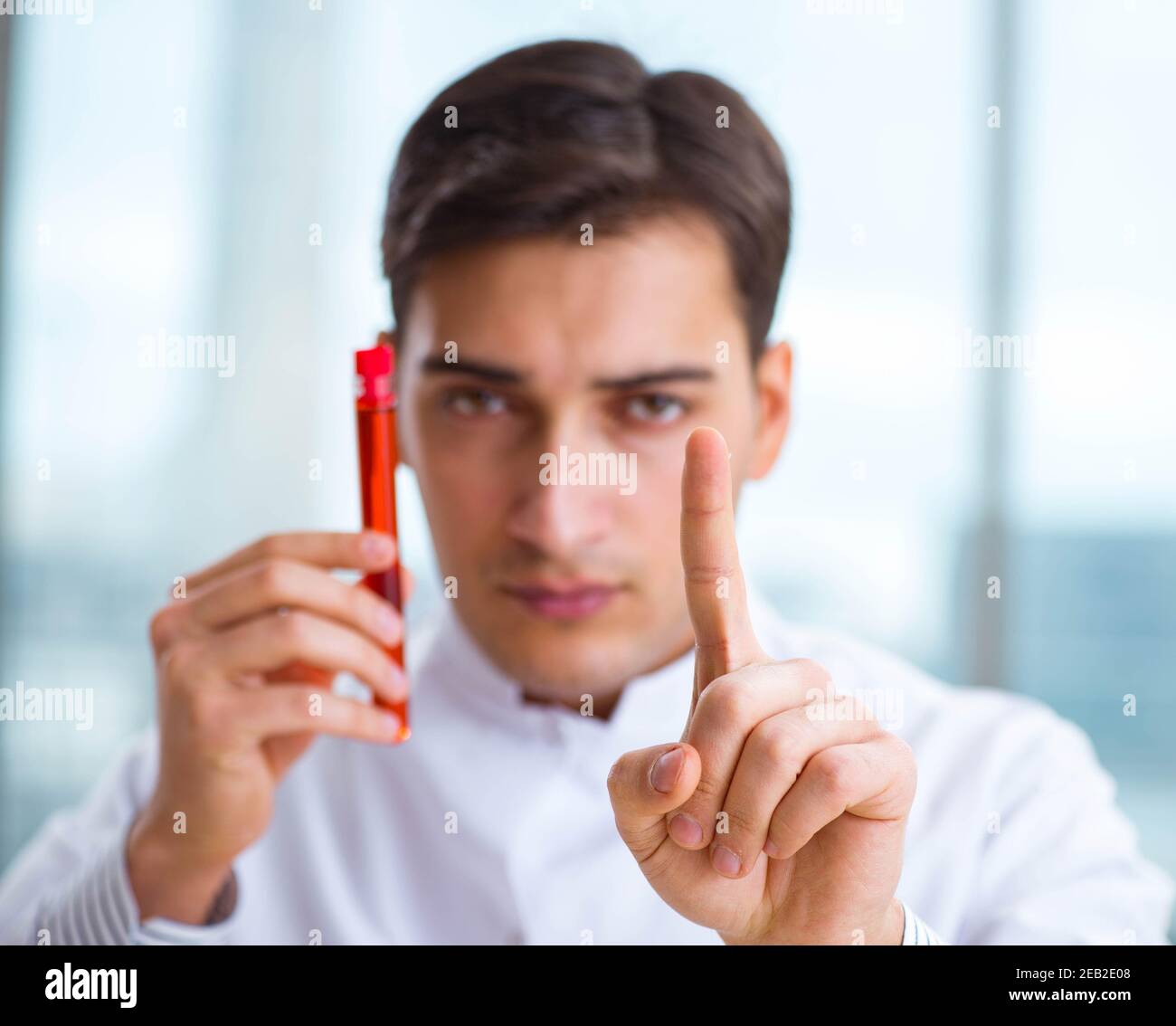 The man doctor checking blood samples in lab Stock Photo - Alamy