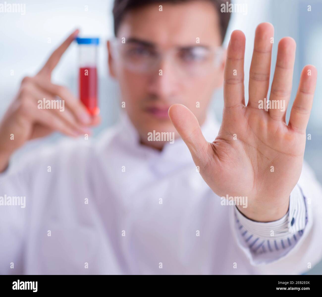 The man doctor checking blood samples in lab Stock Photo - Alamy