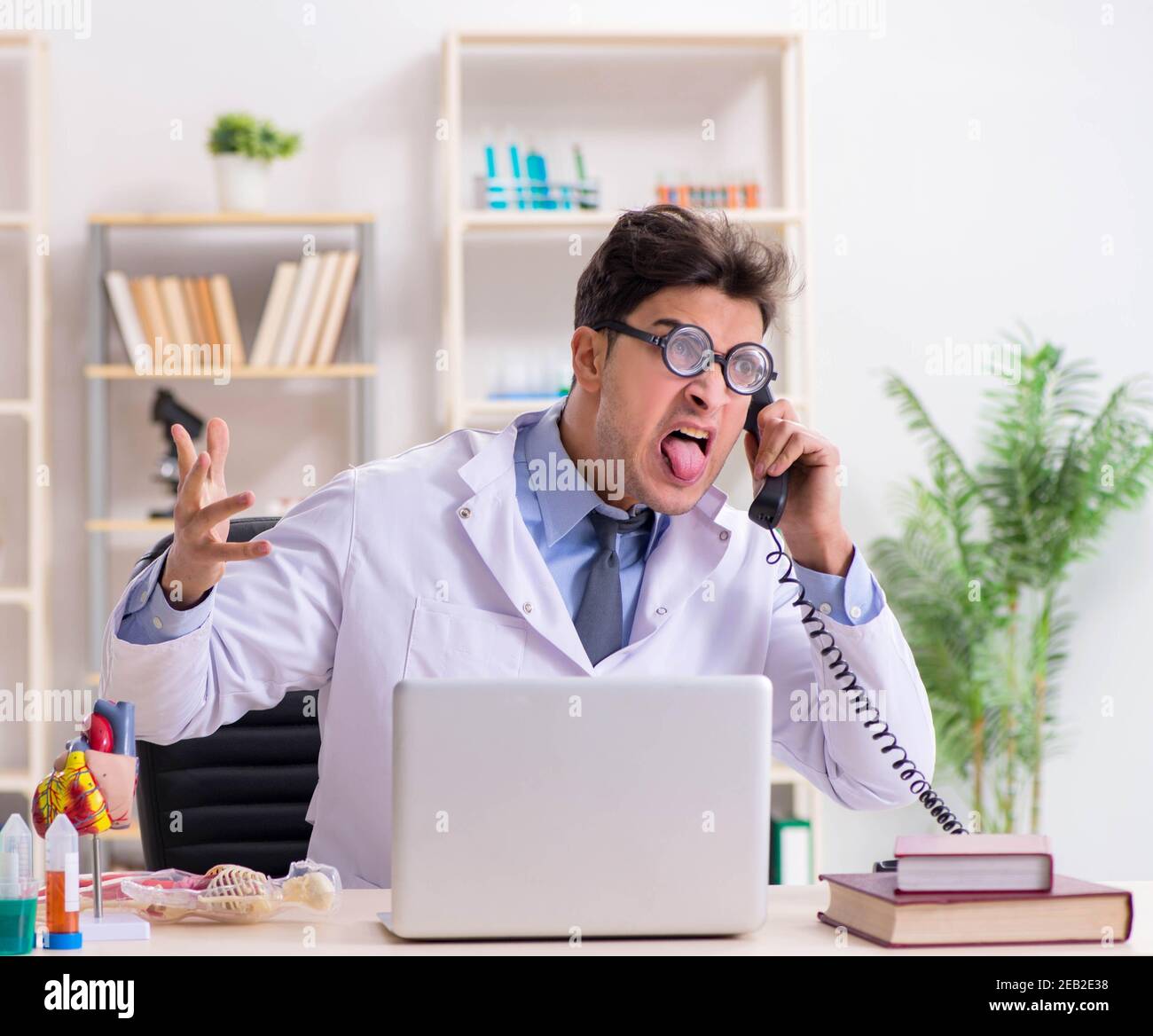 The funny doctor having fun in hospital lab Stock Photo - Alamy