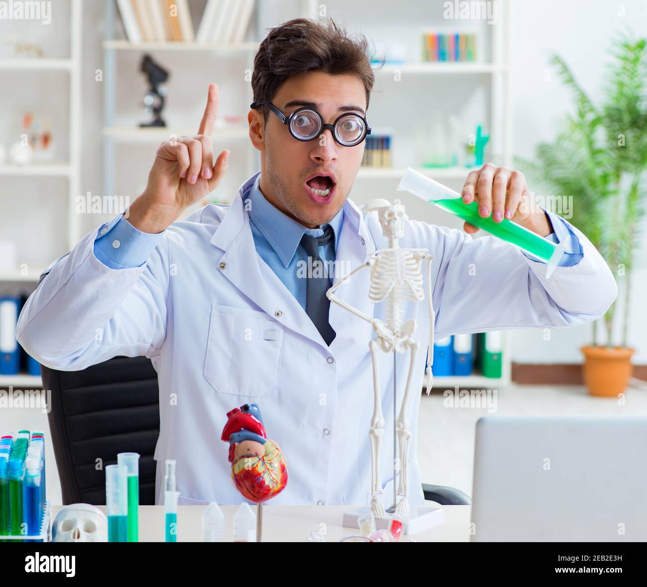The funny doctor having fun in hospital lab Stock Photo - Alamy