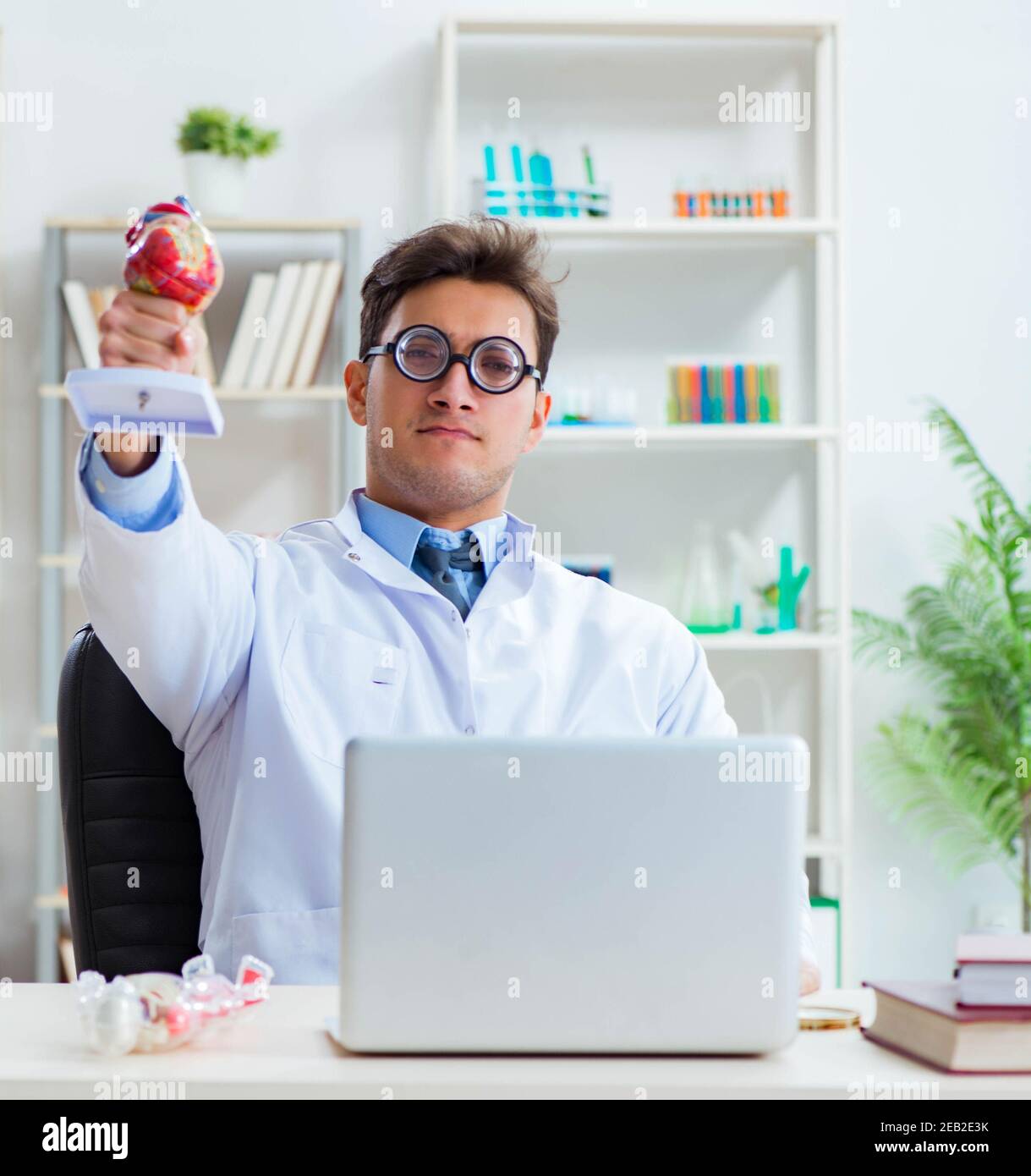The funny doctor having fun in hospital lab Stock Photo - Alamy