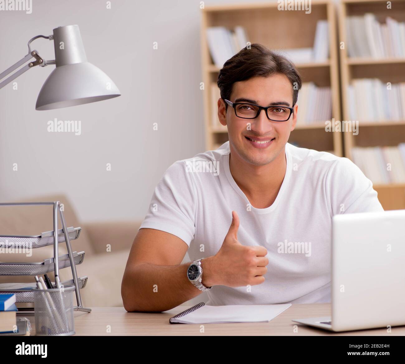 The young man working in the office Stock Photo - Alamy