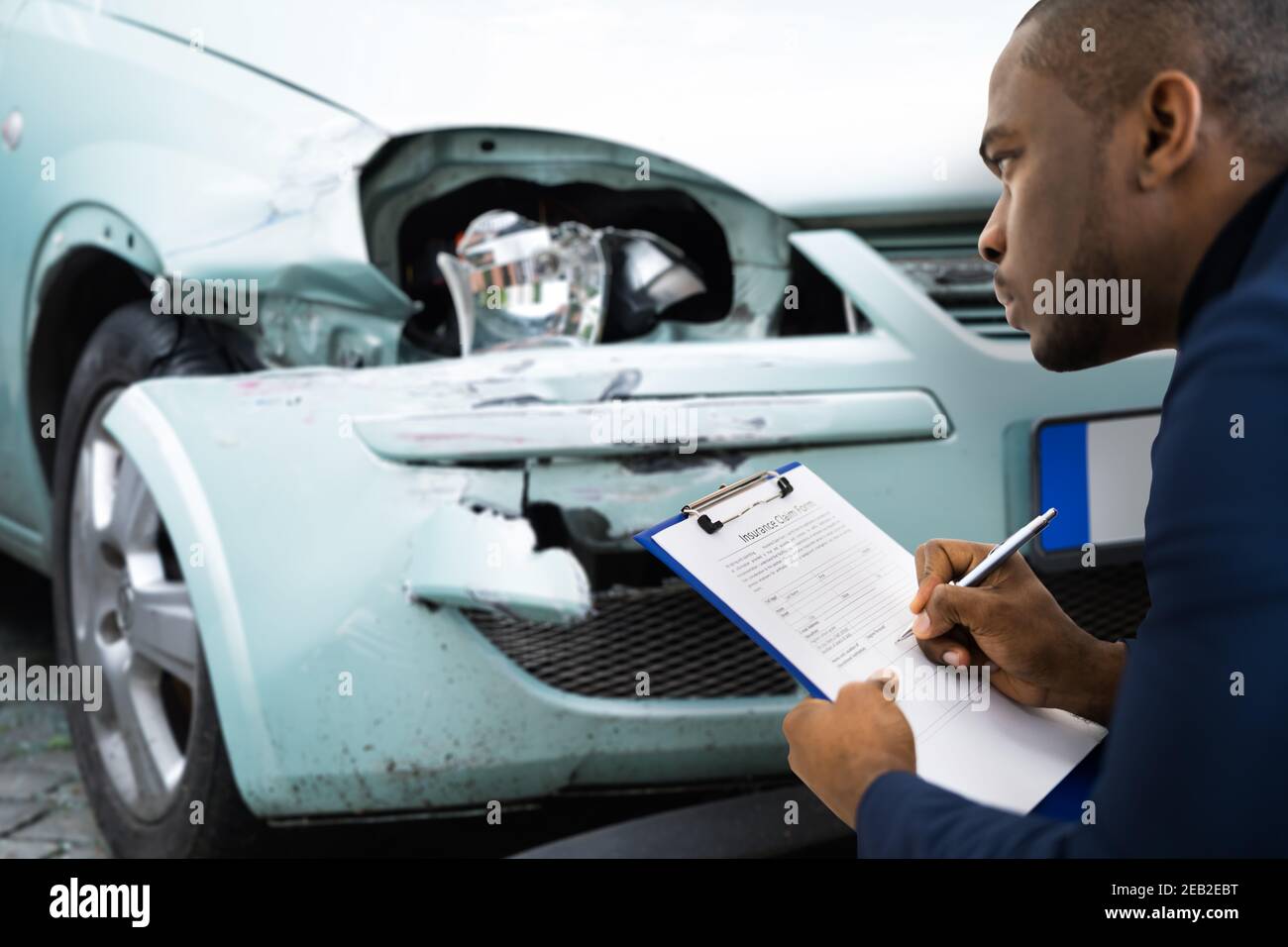 African American Car Insurance Agent Inspecting Accident Claim Stock ...