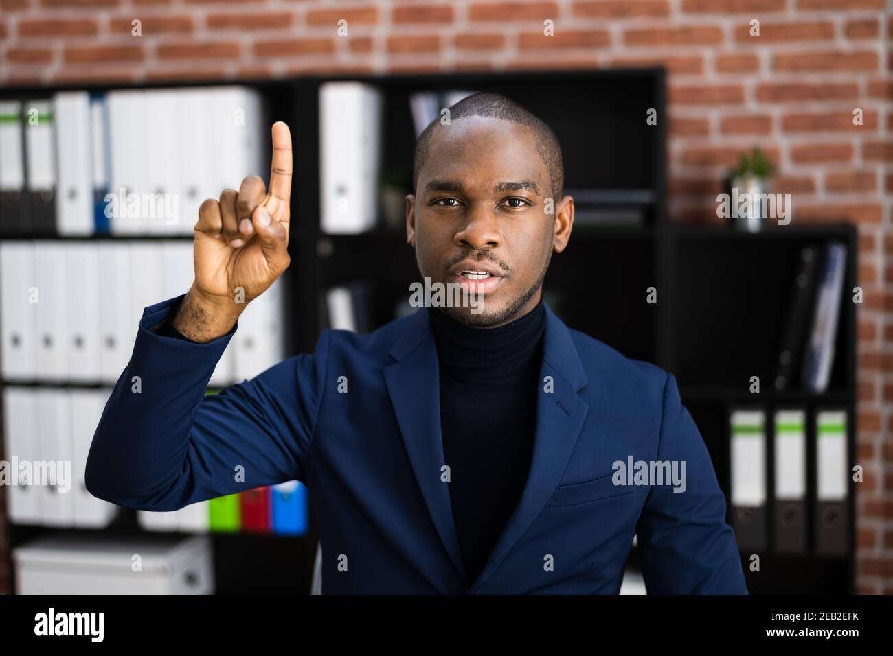 African American Man Raising Hand To Ask Question Stock Photo - Alamy