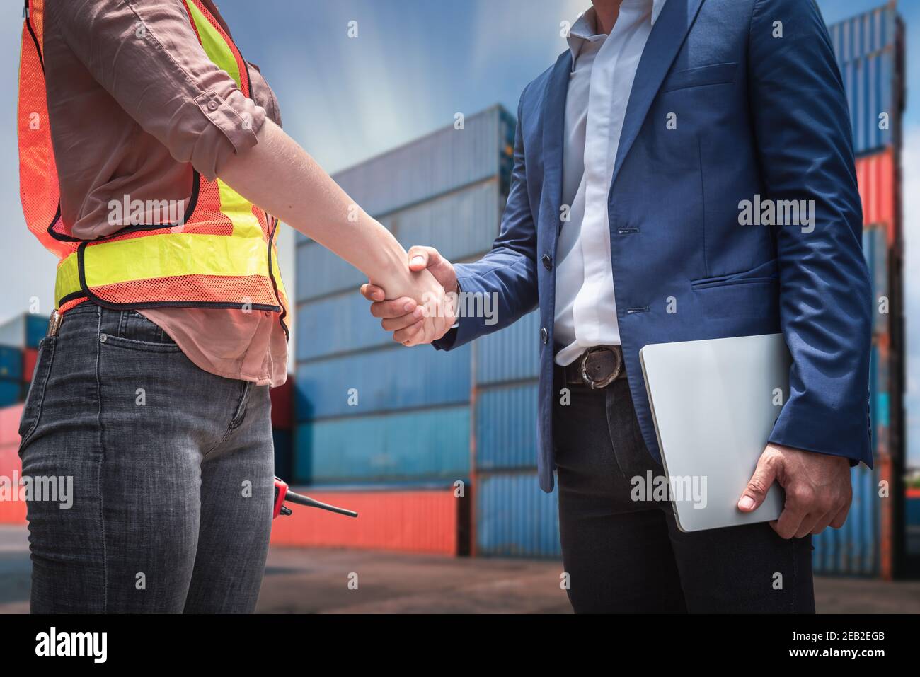 Businessman and Container Shipping Worker Handshake Together for ...
