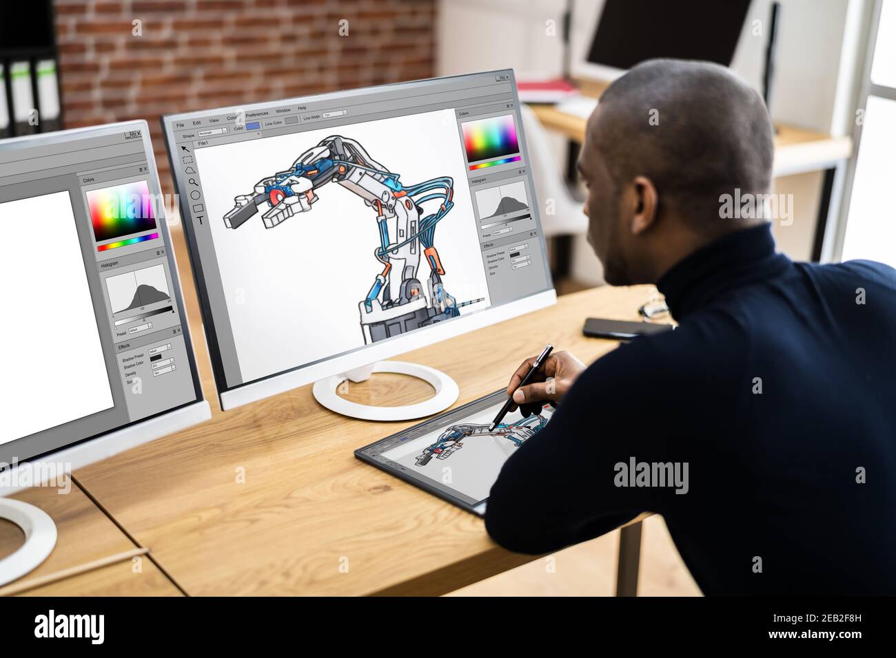 African American Man Using Graphic Tablet Painting On Screen Stock ...