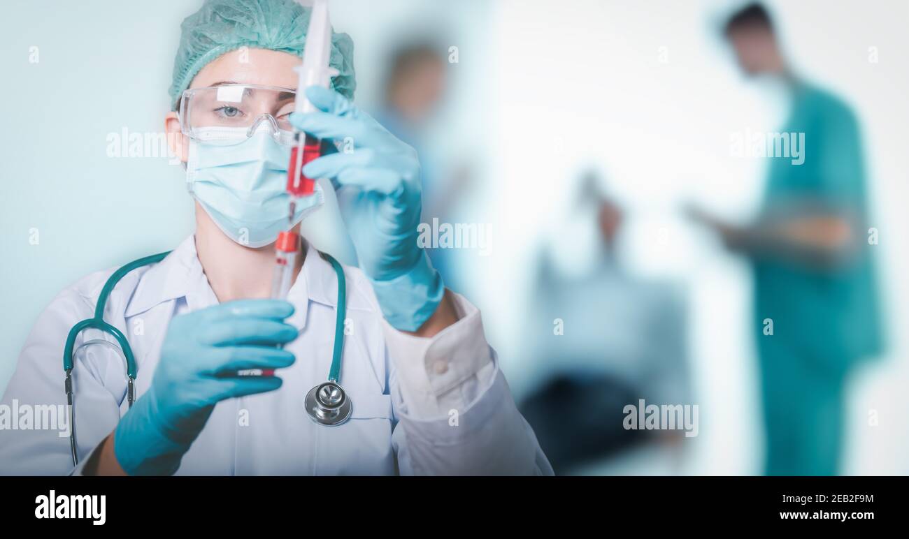 Lab Scientist or Female Doctor Medicine Science is Injecting Blood ...