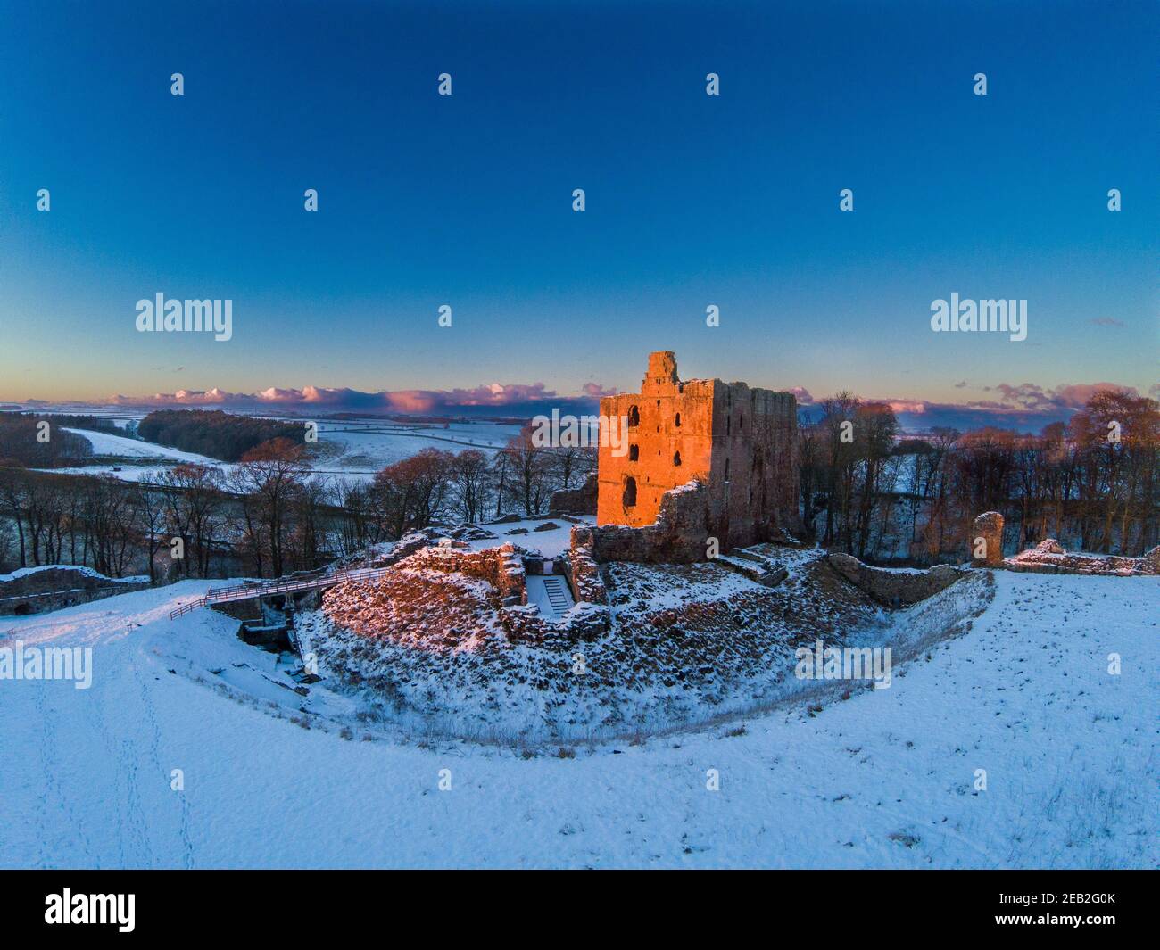 Aerial view of Norham Castle which stands guard over the River Tweed a ...
