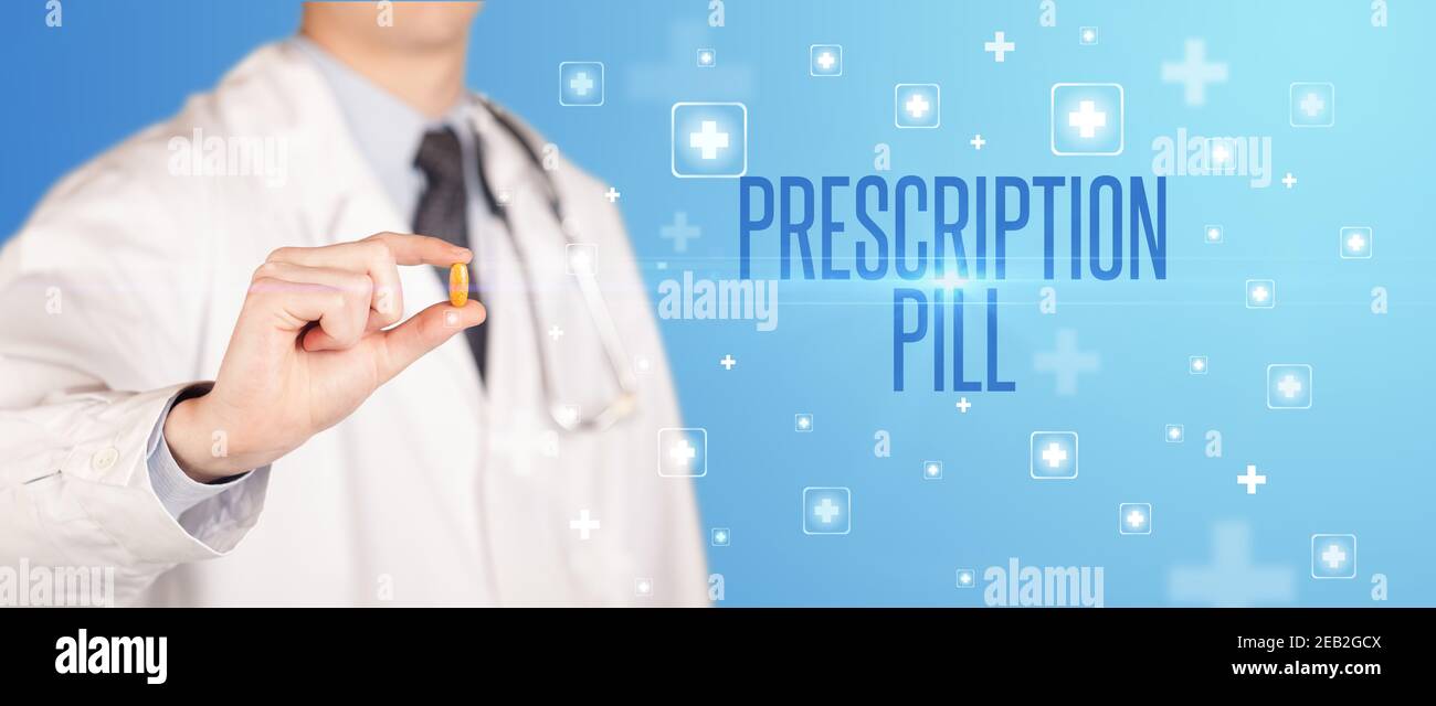 Close-up of a doctor giving a pill with PRESCRIPTION PILL inscription ...