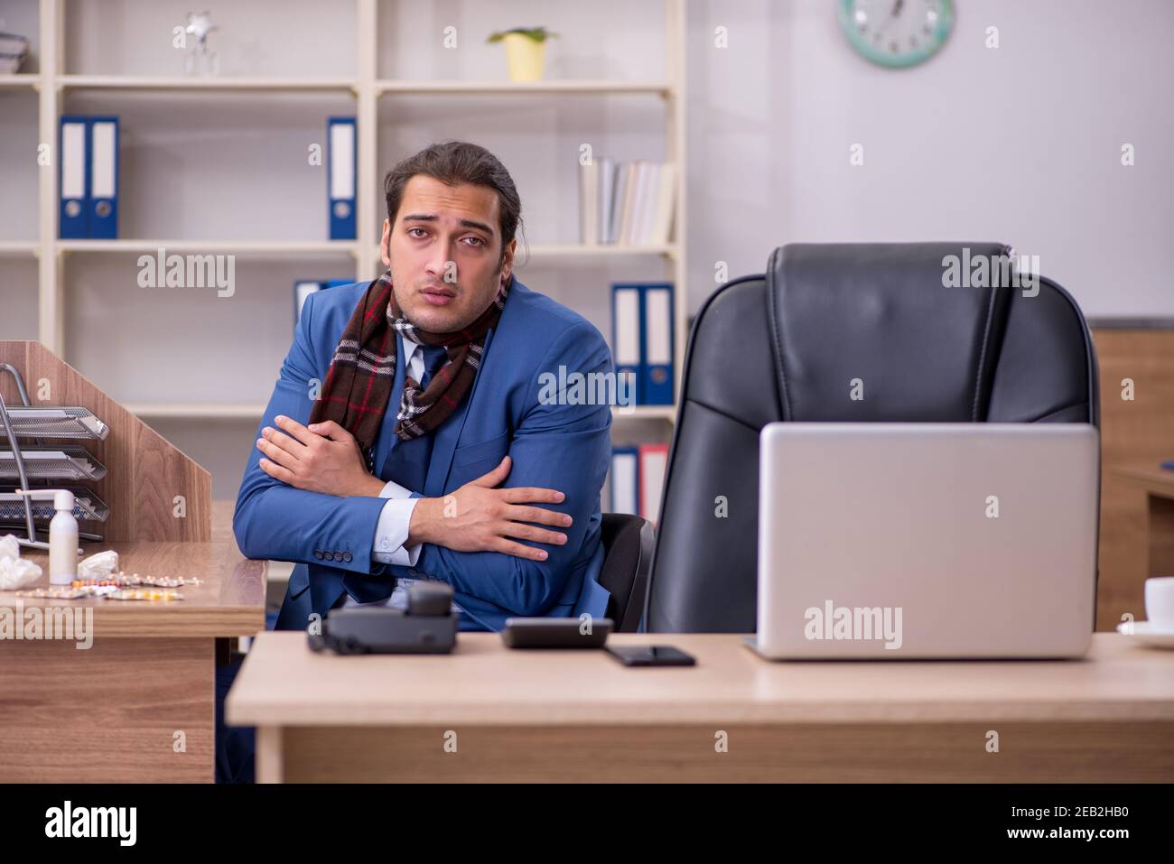 Sick businessman employee suffering at workplace Stock Photo - Alamy