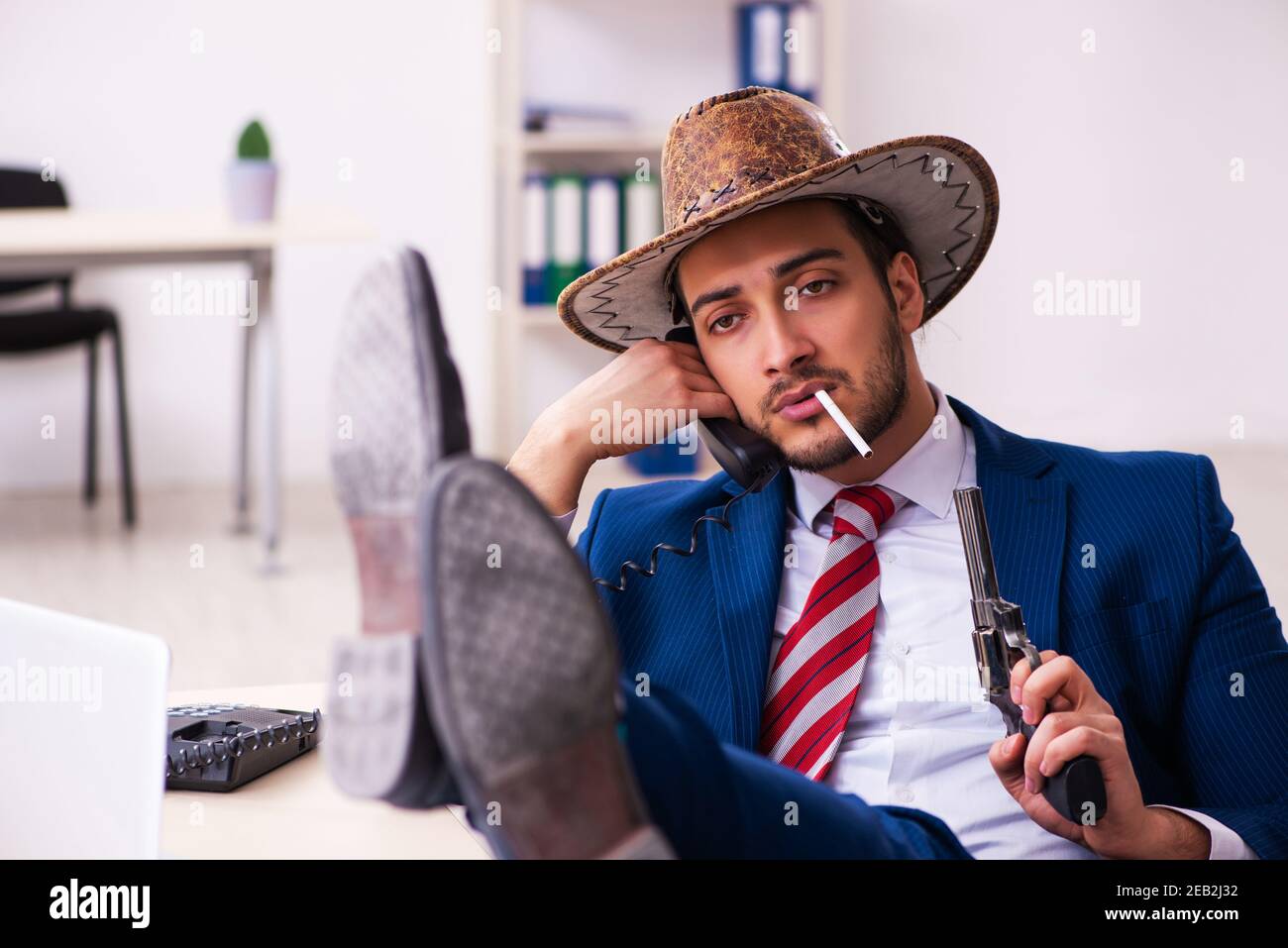 Young cowboy smoking cigarette hi-res stock photography and images - Alamy
