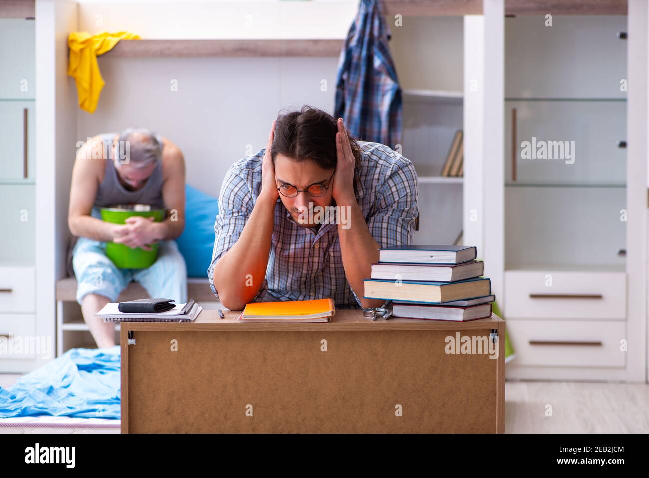 Young son student and dad alcoholic at home Stock Photo - Alamy