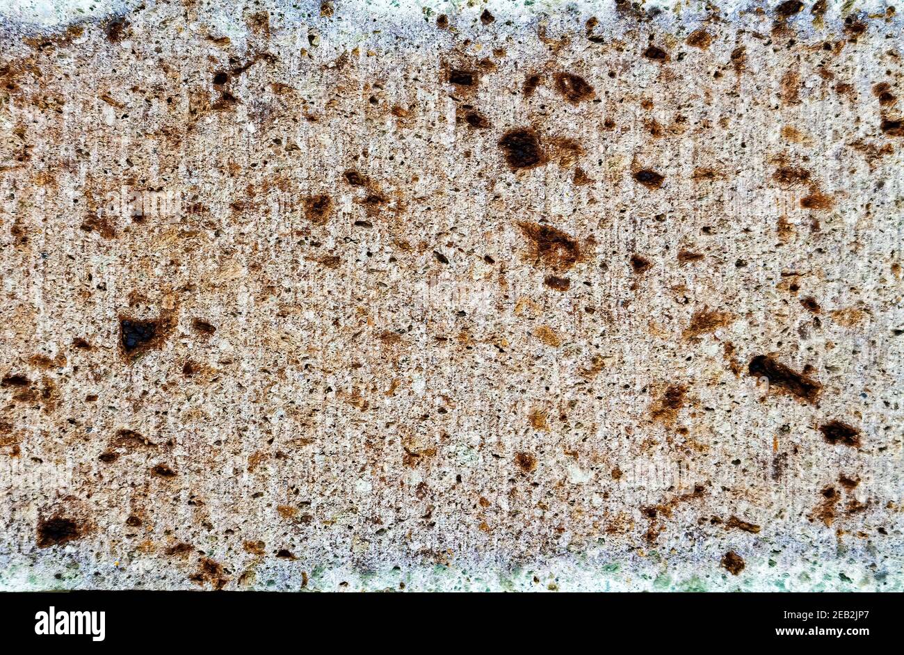 Closeup of a single brick of stone, with lots of colorful chunks in it ...