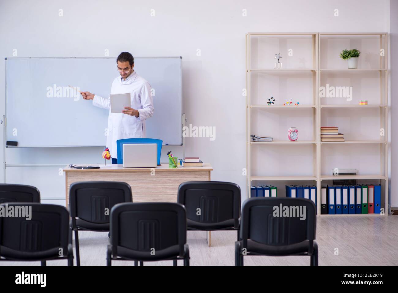 Young doctor giving seminar in the classroom Stock Photo - Alamy