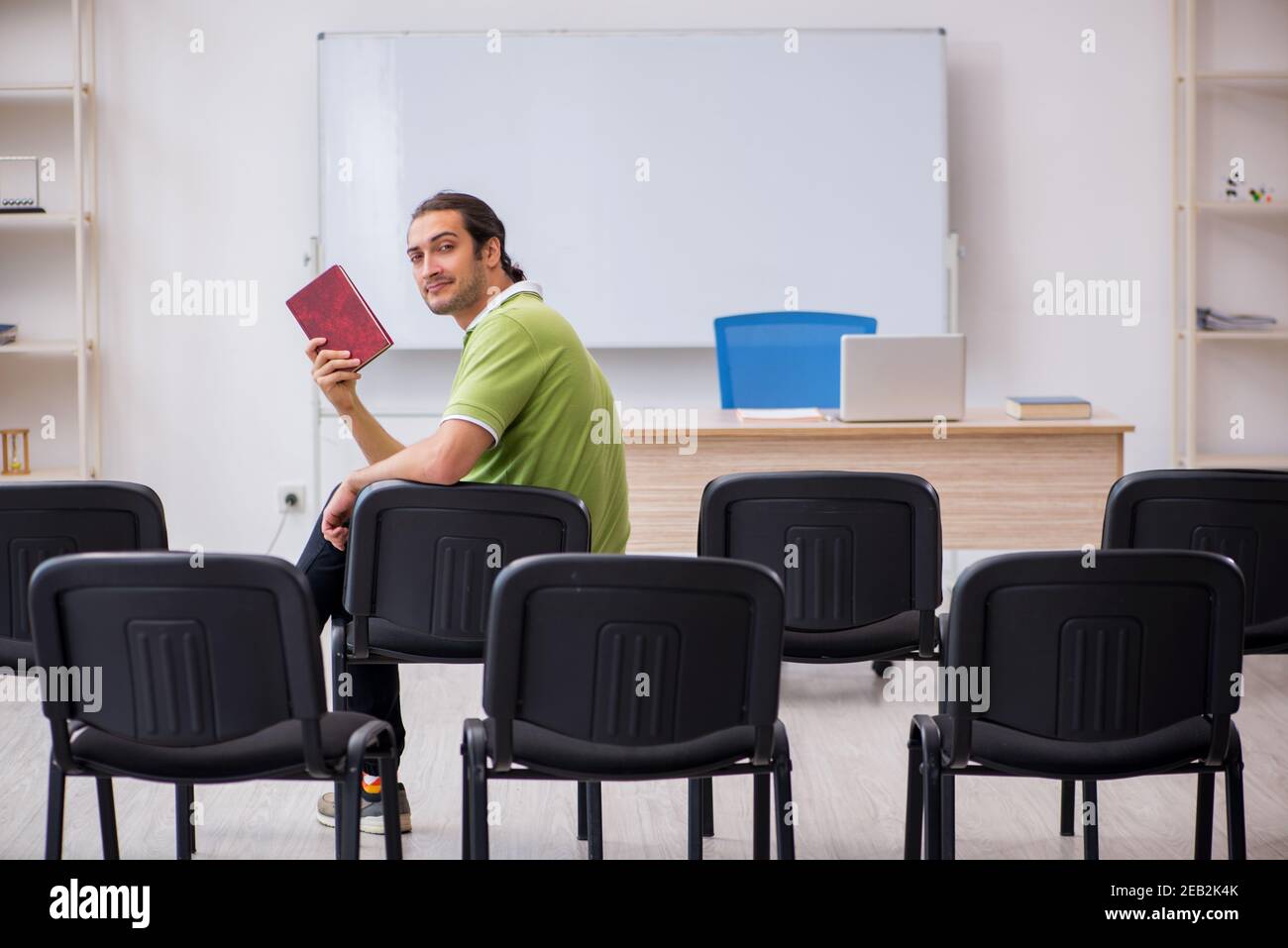 Young student in business presentation concept Stock Photo - Alamy