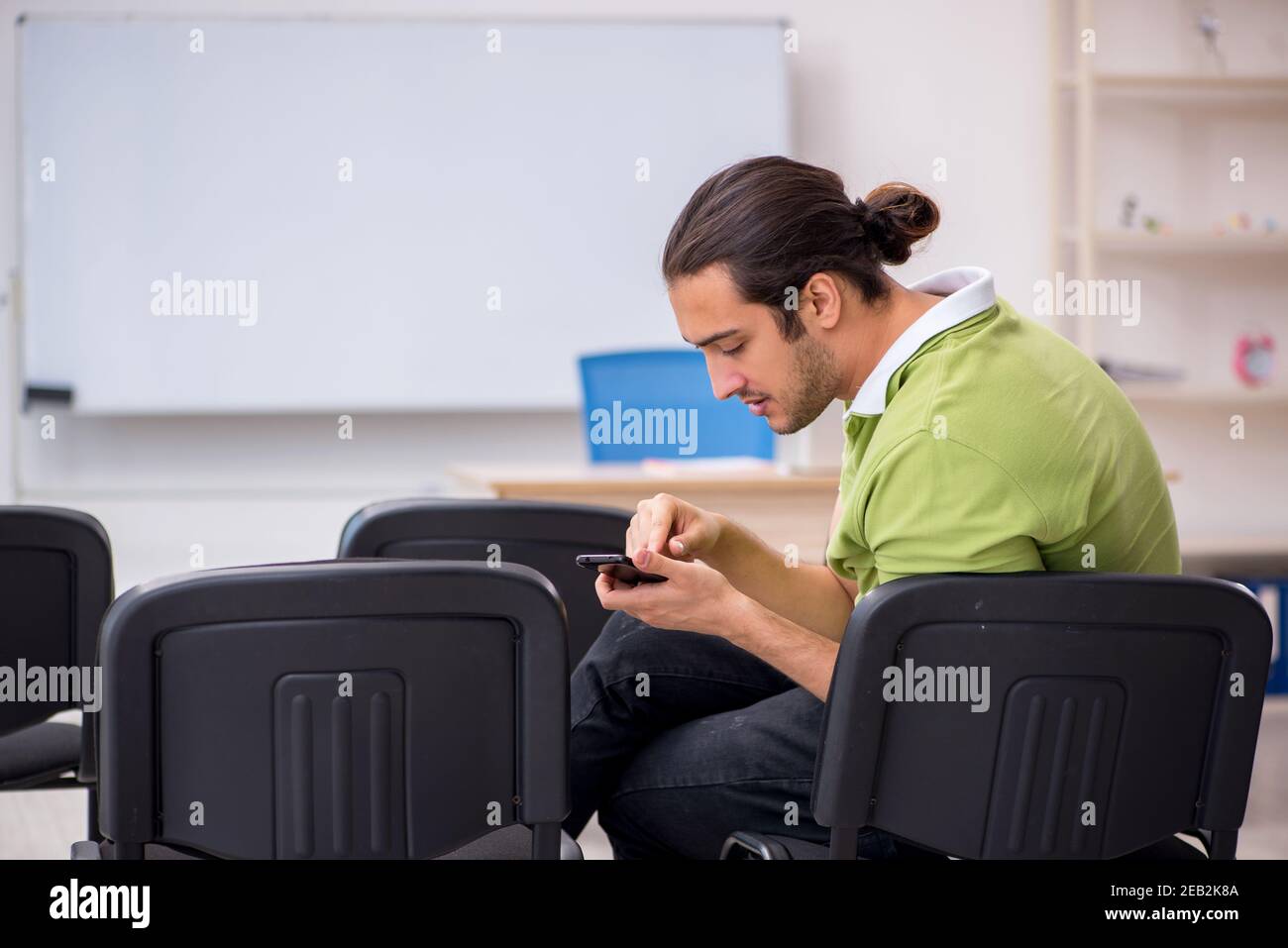 Young student in business presentation concept Stock Photo - Alamy