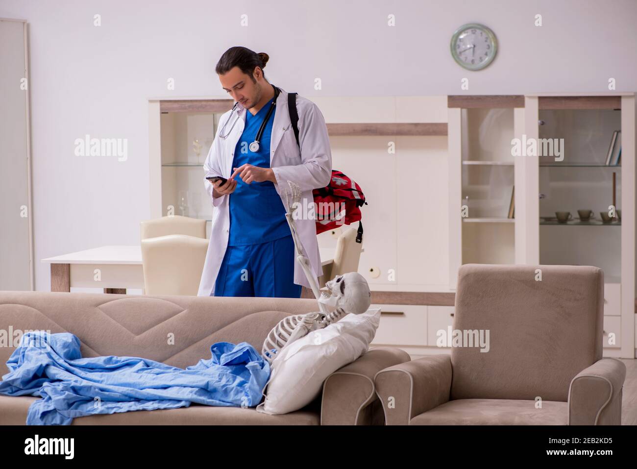 Male paramedic visiting skeleton patient Stock Photo - Alamy