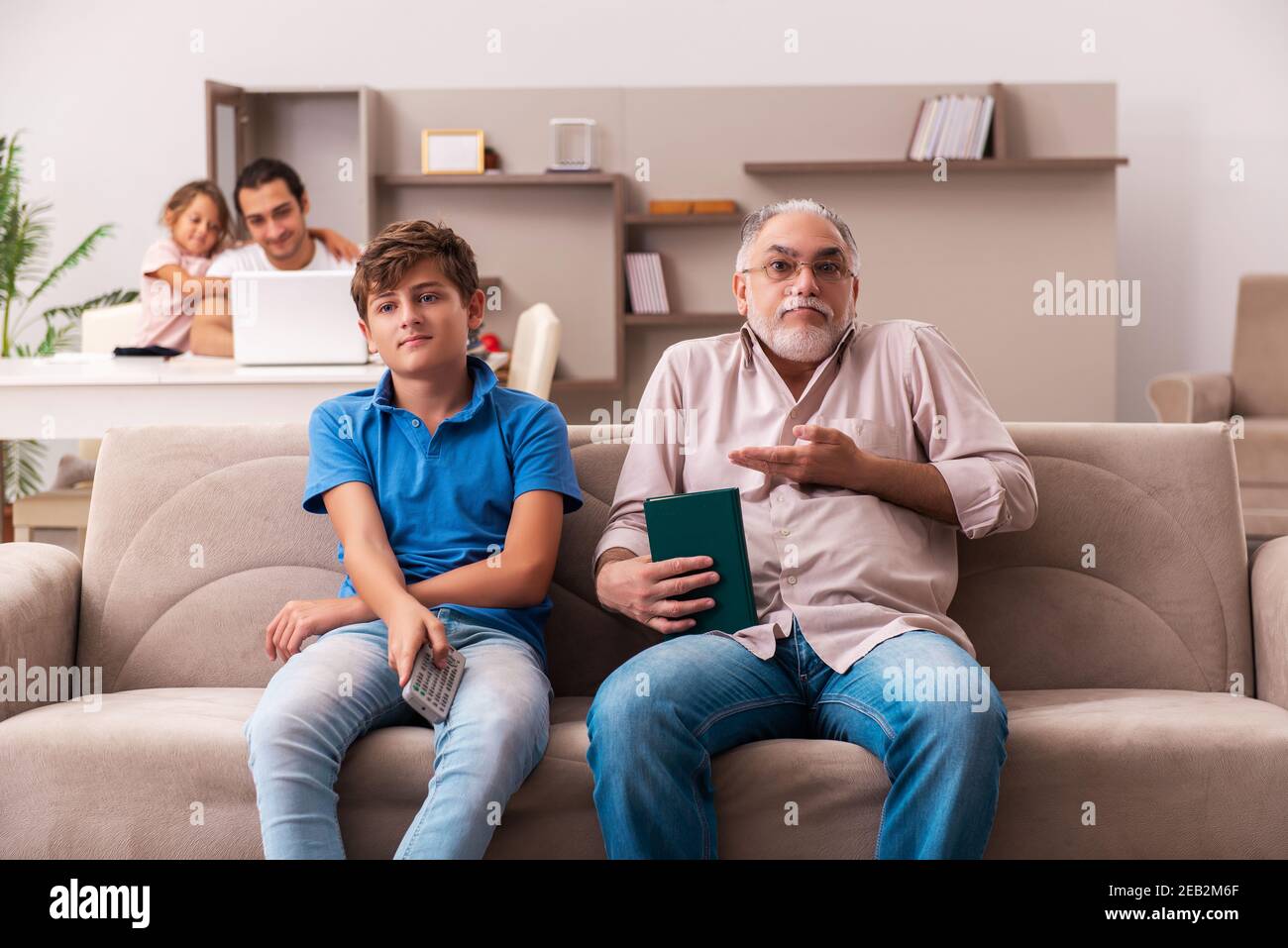 Three generations at home in early development concept Stock Photo - Alamy