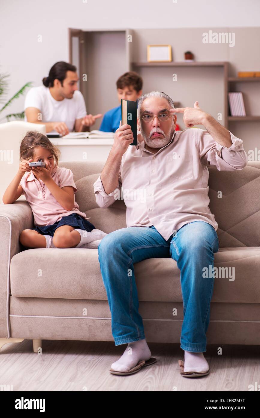 Three generations at home in early development concept Stock Photo - Alamy