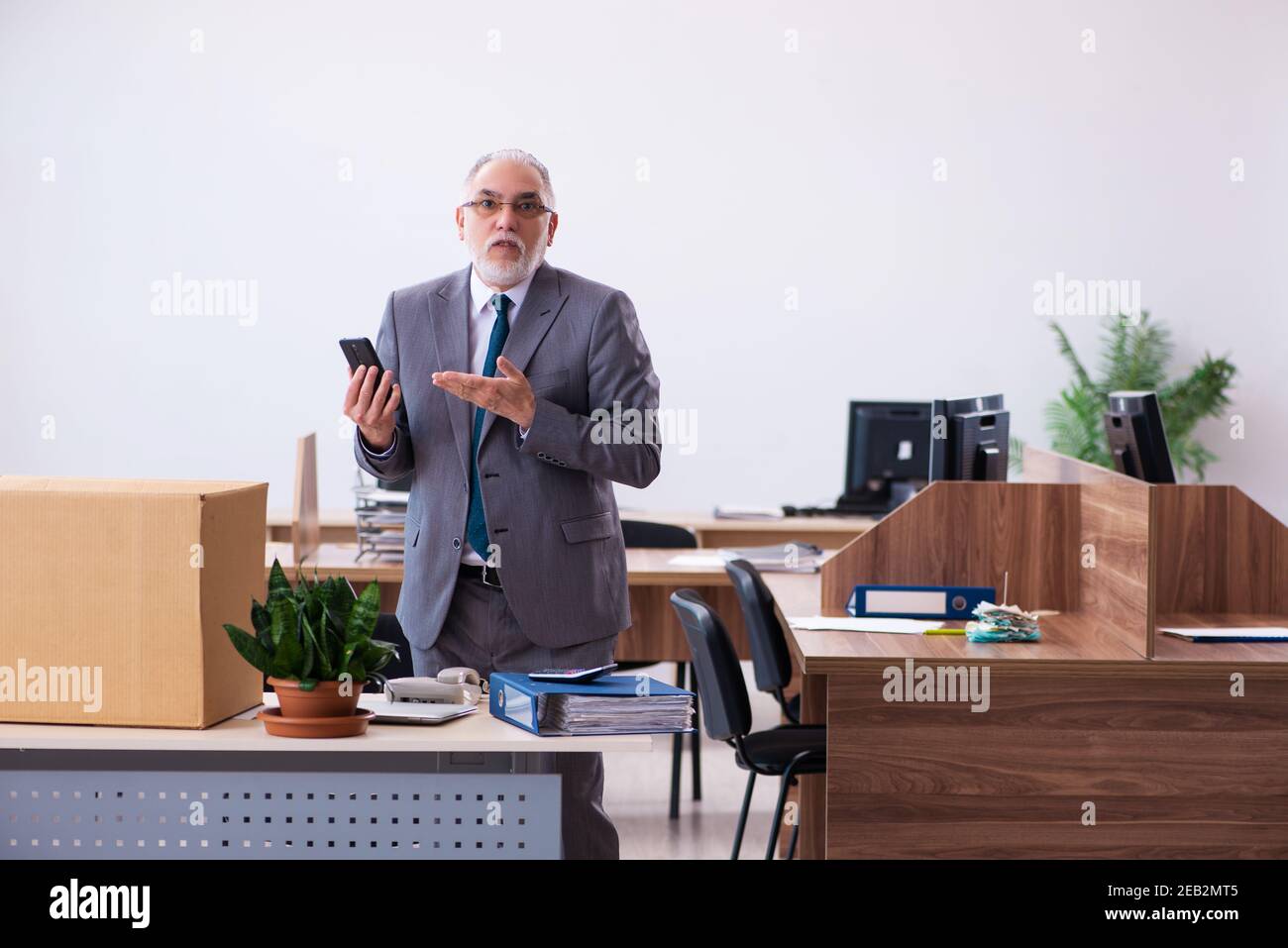 Old employee being fired from his work Stock Photo - Alamy