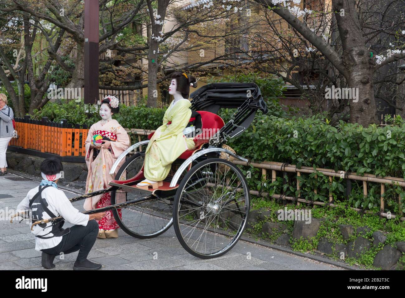 Kyoto Japan Two women dressed as Geisha and a rickshaw driver pose for ...