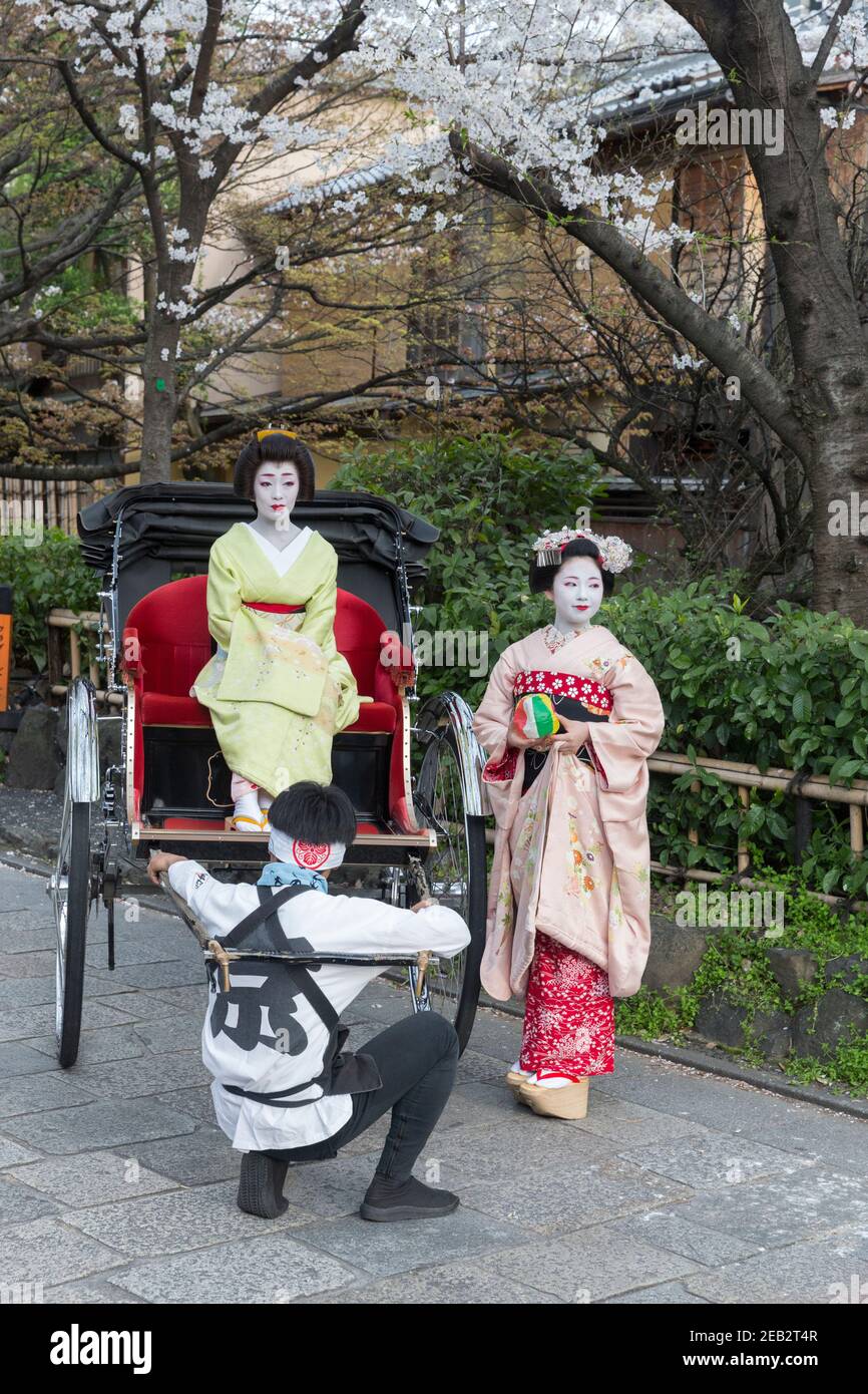 Kyoto Japan Two women dressed as Geisha and a rickshaw driver pose for ...