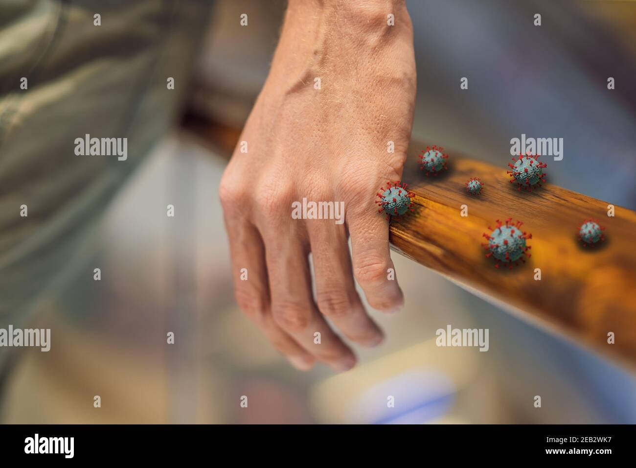 Hand touching footbridge railing handrail, risk to contaminated with ...