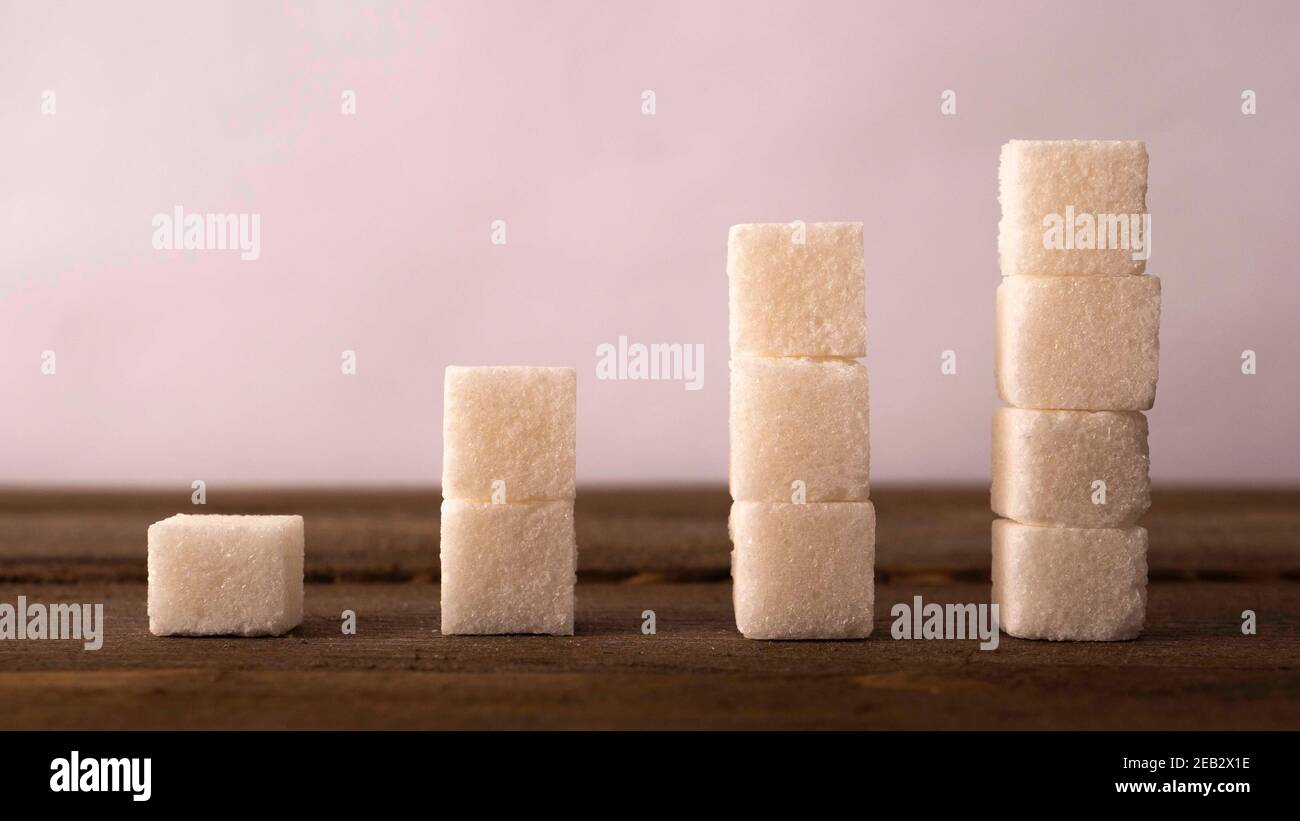 Reduce Sugar Concept. Sugar Cubes In Declining Chart Stock Photo - Alamy