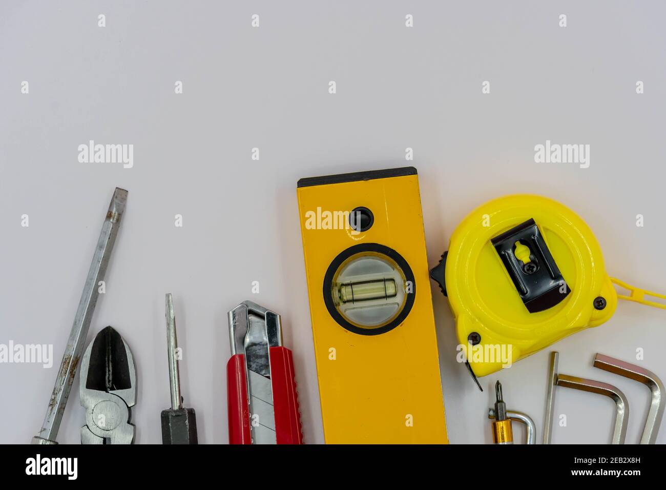 Top view of Working tools of a handy man on white background.flat lay ...