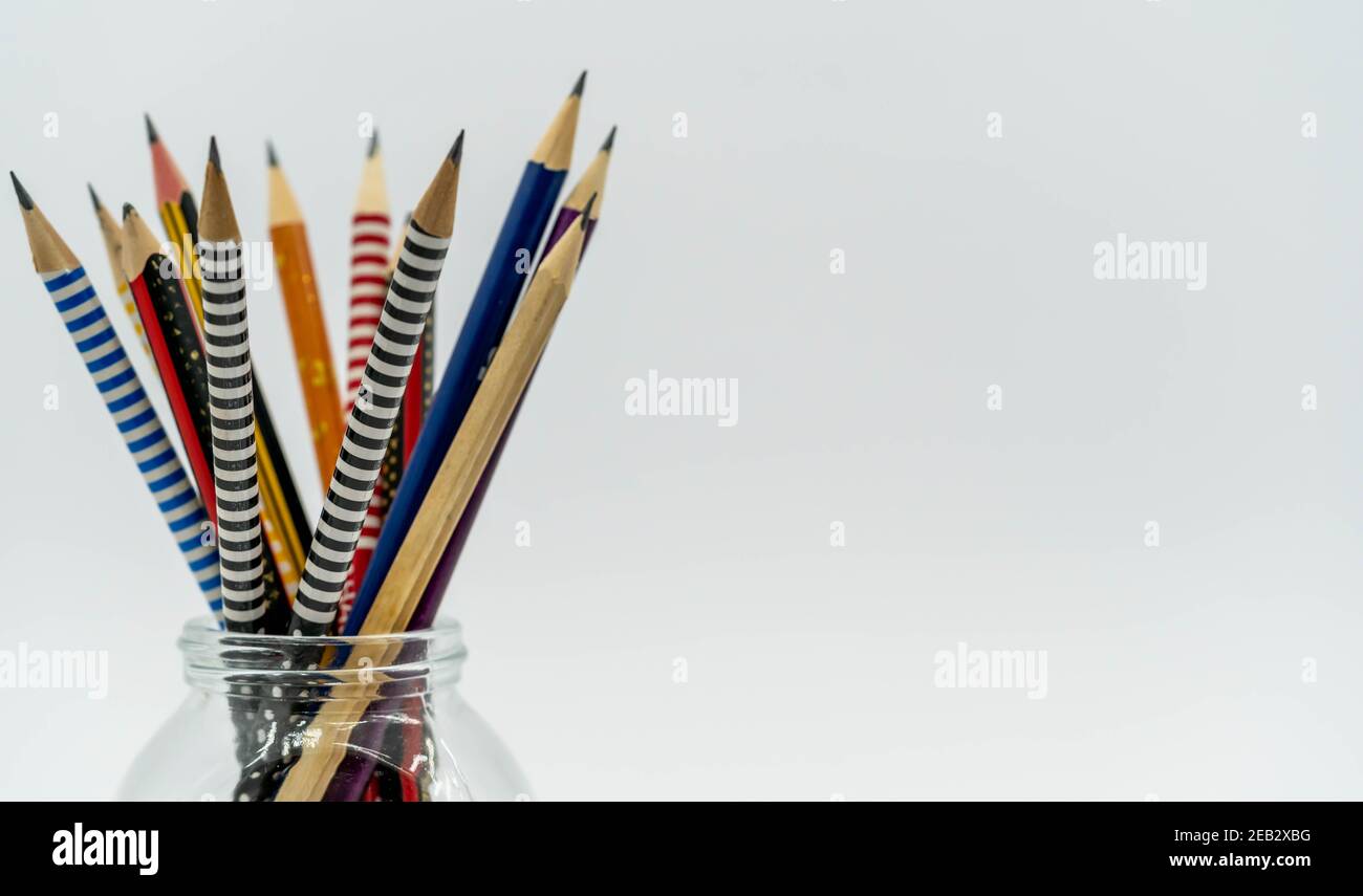 Pencils in a pencil bucket on white background. Back to school concept ...