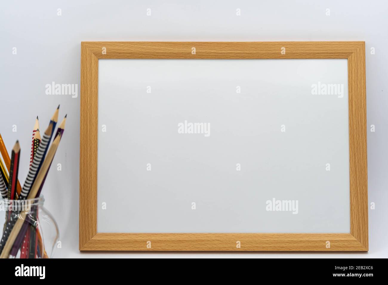 A wooden frame with blank white screen on white background Stock Photo ...