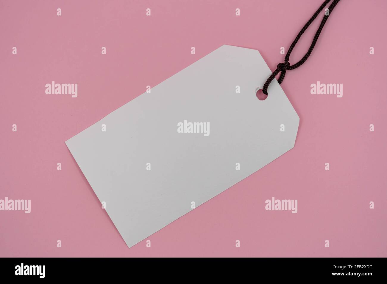 Multiple blank white tag price on pink background Stock Photo - Alamy