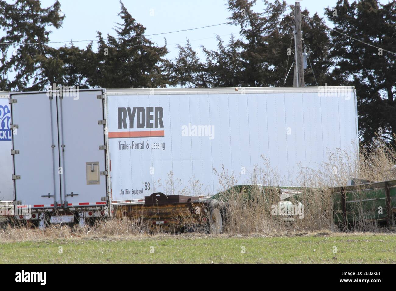 Ryder Truck trailer with tree's and blue sky out in the country waiting ...