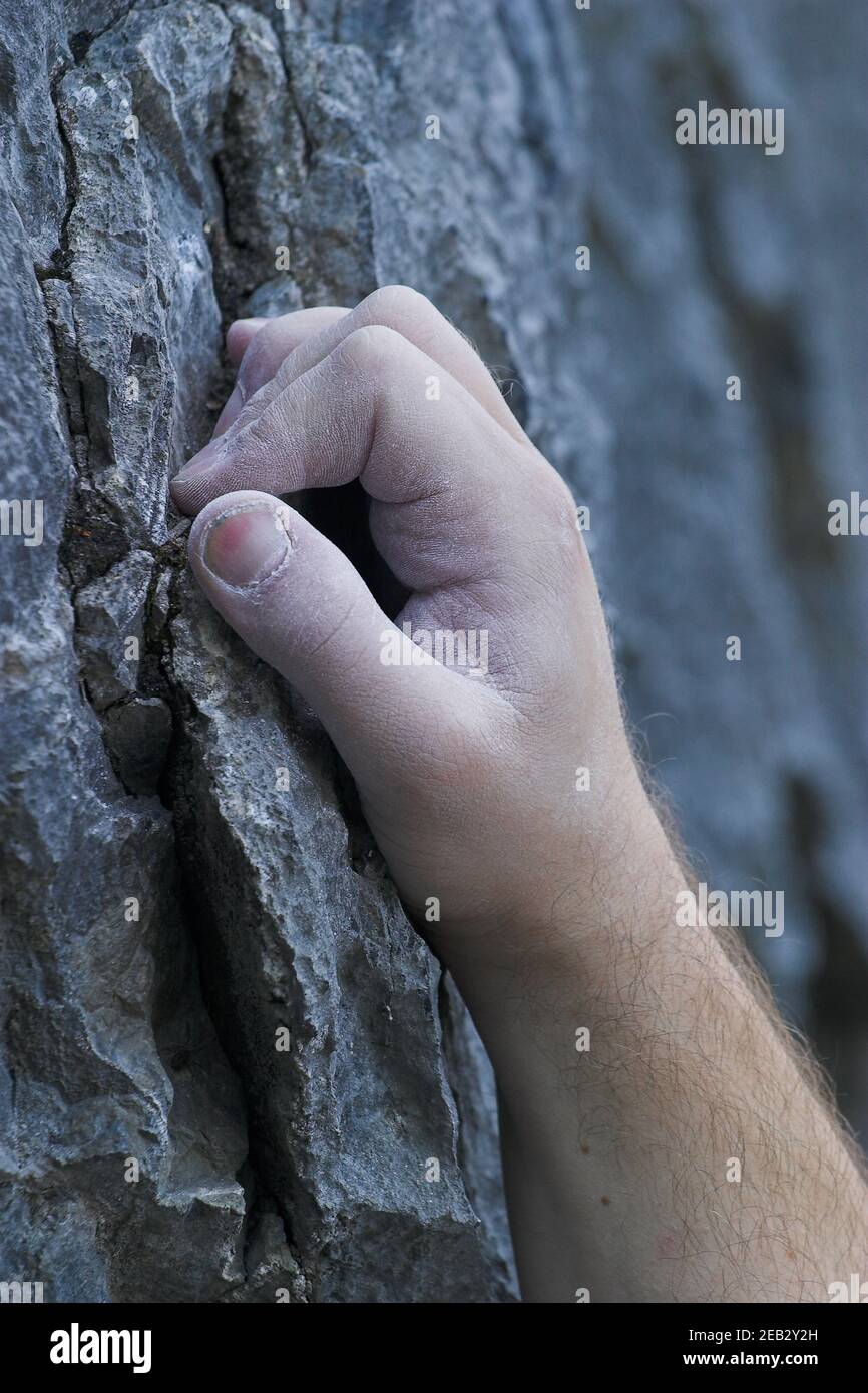 A single male hand on a cliff, rock climbing Stock Photo - Alamy