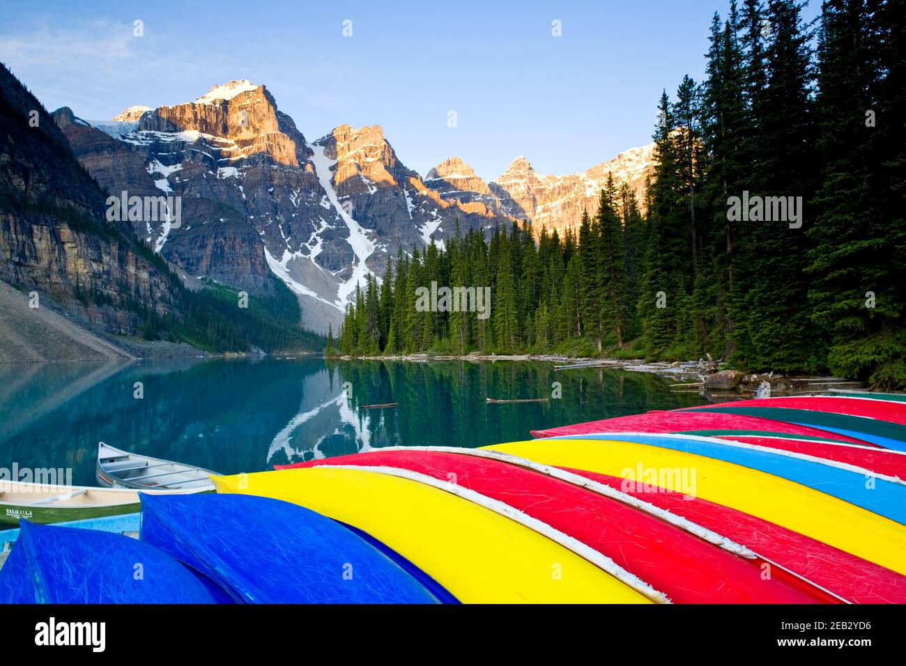 Colorful canoes at Moraine Lake, Banff National Park, Canada at sunrise ...