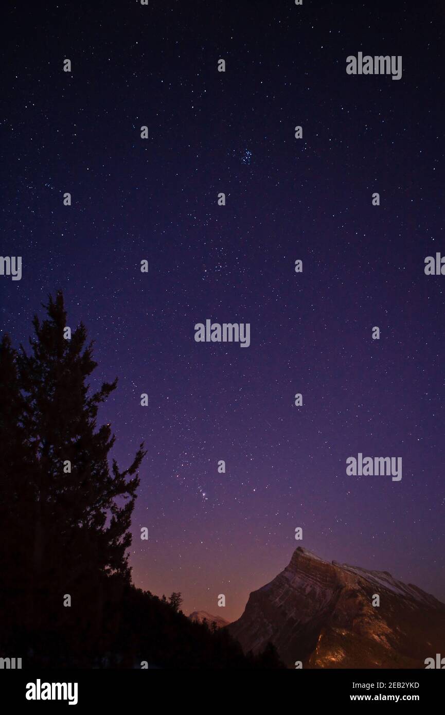 The night sky over the town of Banff in Banff National Park, Alberta ...