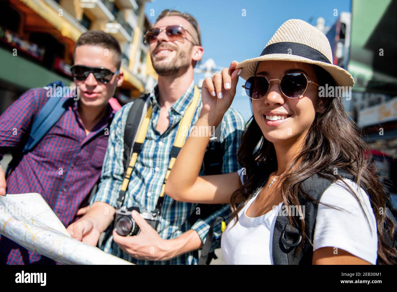 Group of multiethnic tourist backpacker friends traveling in Bangkok ...