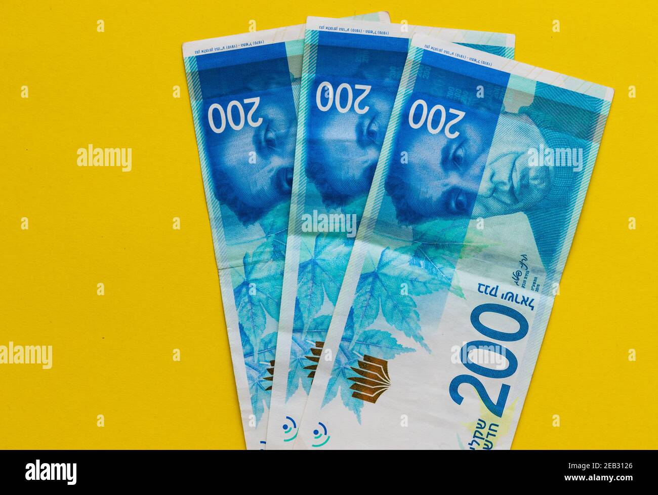 New Israeli banknotes of two hundred shekels, yellow background Stock ...