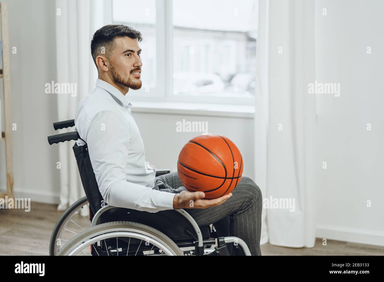 Disabled sportsman holding basketball hi-res stock photography and ...