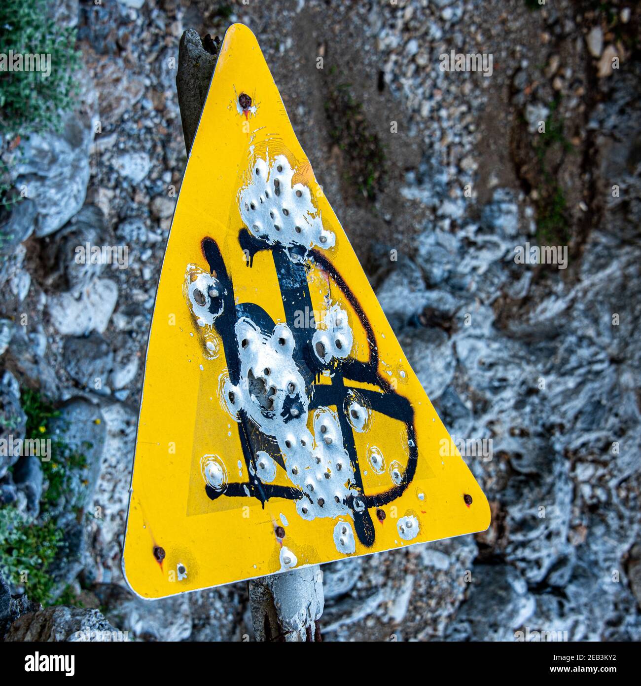 Bullet ridden roadside sign Stock Photo - Alamy