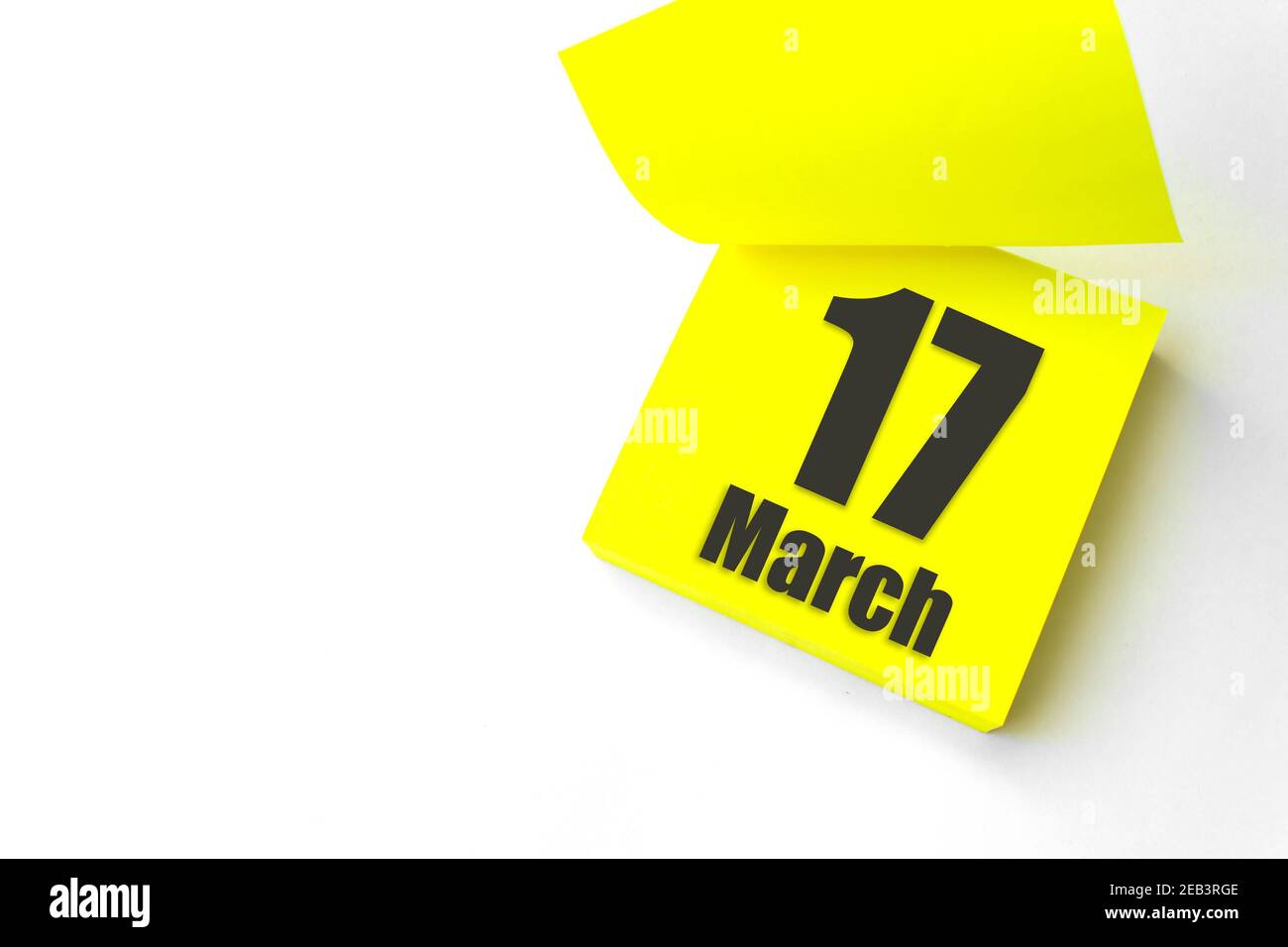 March 17th. Day 17 of month, Calendar date. Close-Up Blank Yellow paper ...