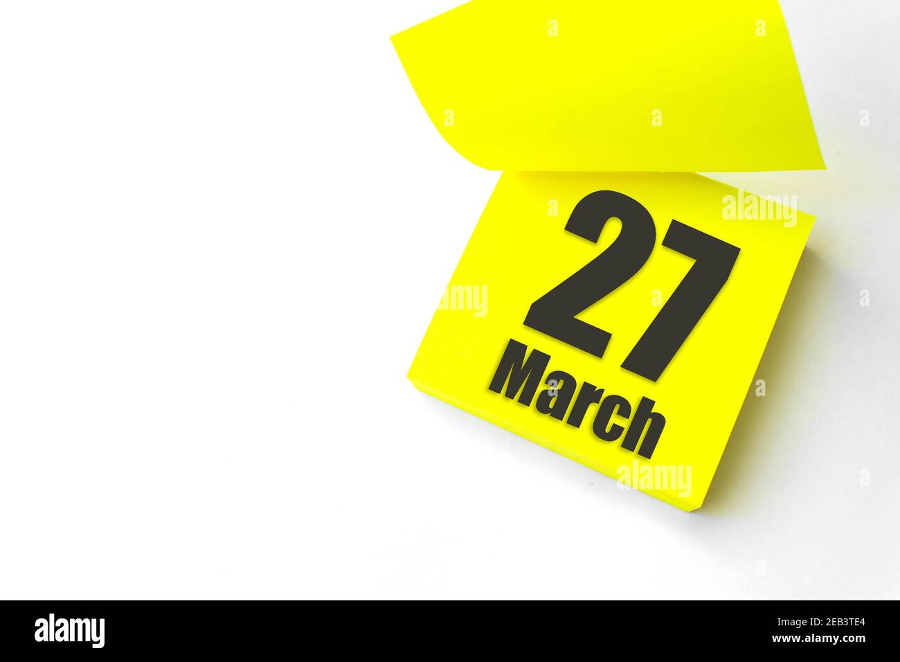 March 27th. Day 27 of month, Calendar date. Close-Up Blank Yellow paper ...