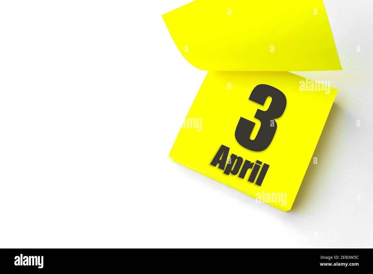 April 3rd. Day 3 of month, Calendar date. Close-Up Blank Yellow paper ...