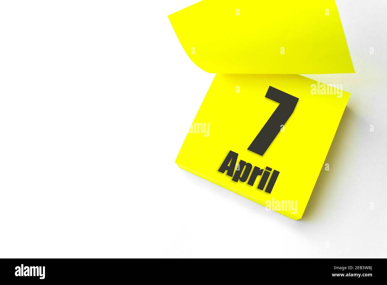 April 7th. Day 7 of month, Calendar date. Close-Up Blank Yellow paper ...