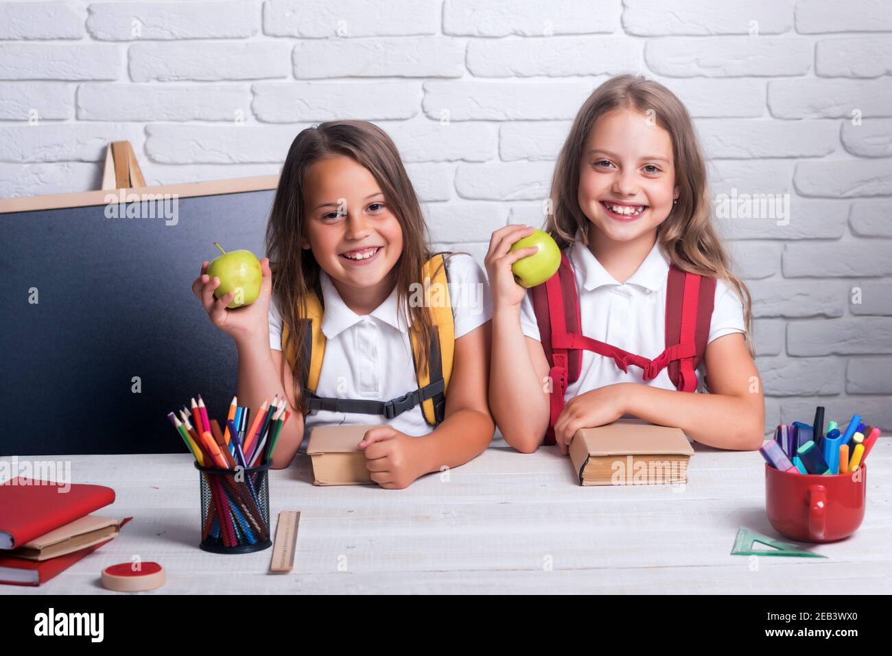 Little girls in classroom at knowledge day. School time of girls. Happy ...