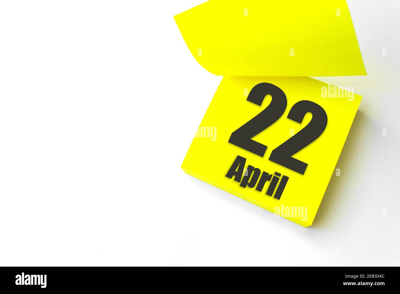 April 22nd. Day 22 of month, Calendar date. Close-Up Blank Yellow paper ...