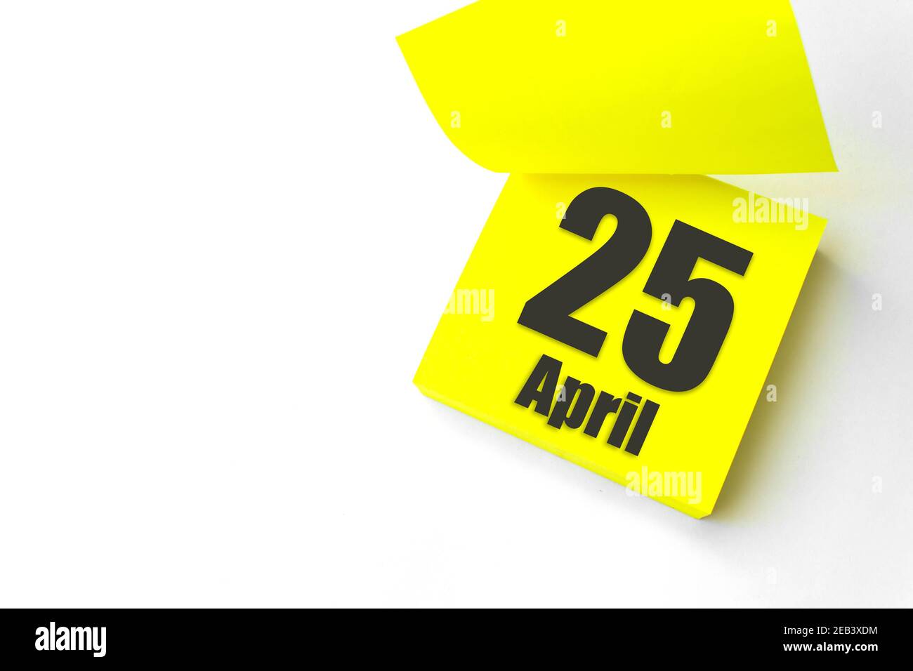 April 25th. Day 25 of month, Calendar date. Close-Up Blank Yellow paper ...